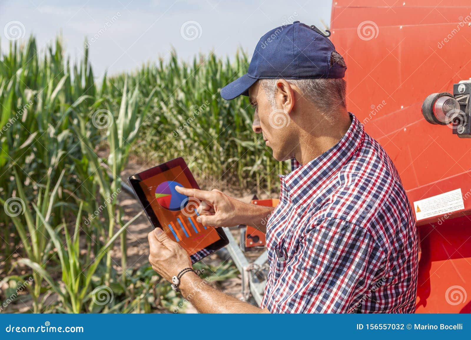 Modern Technological Farmer Checking the Growth Data of Corn on Tablet ...