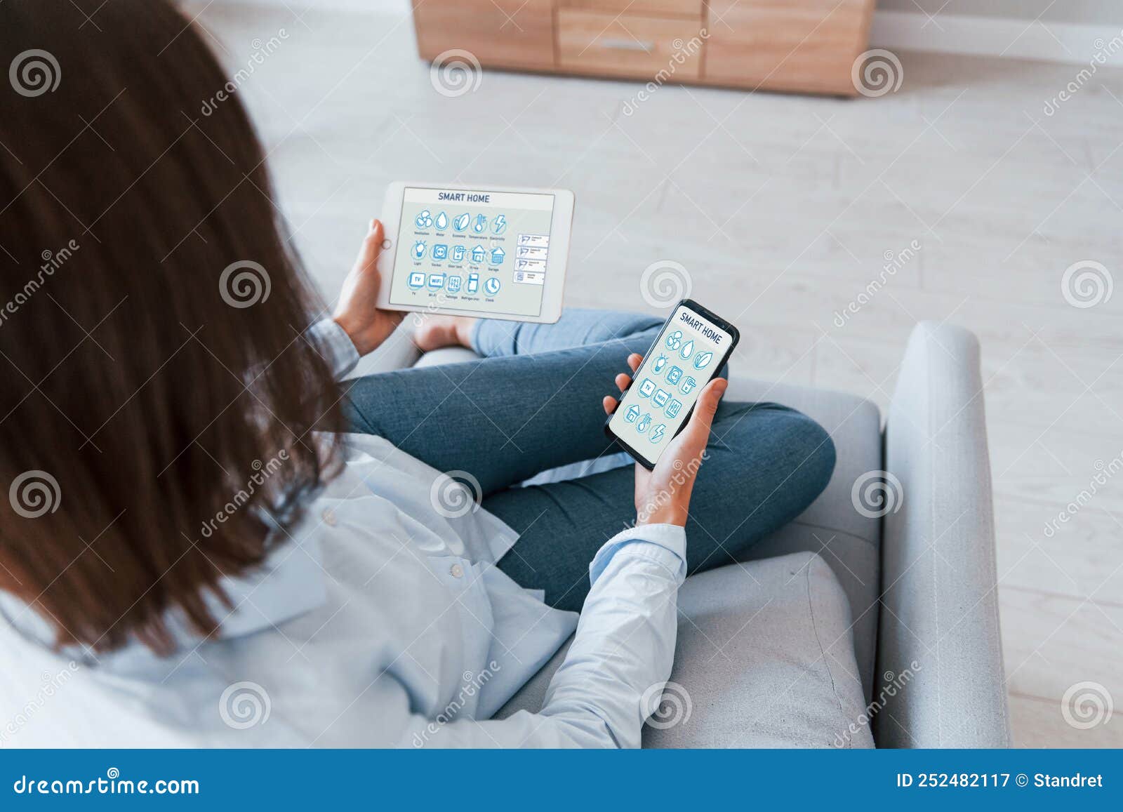Modern Technologies. Rear View of Woman that is Indoors Controlling ...
