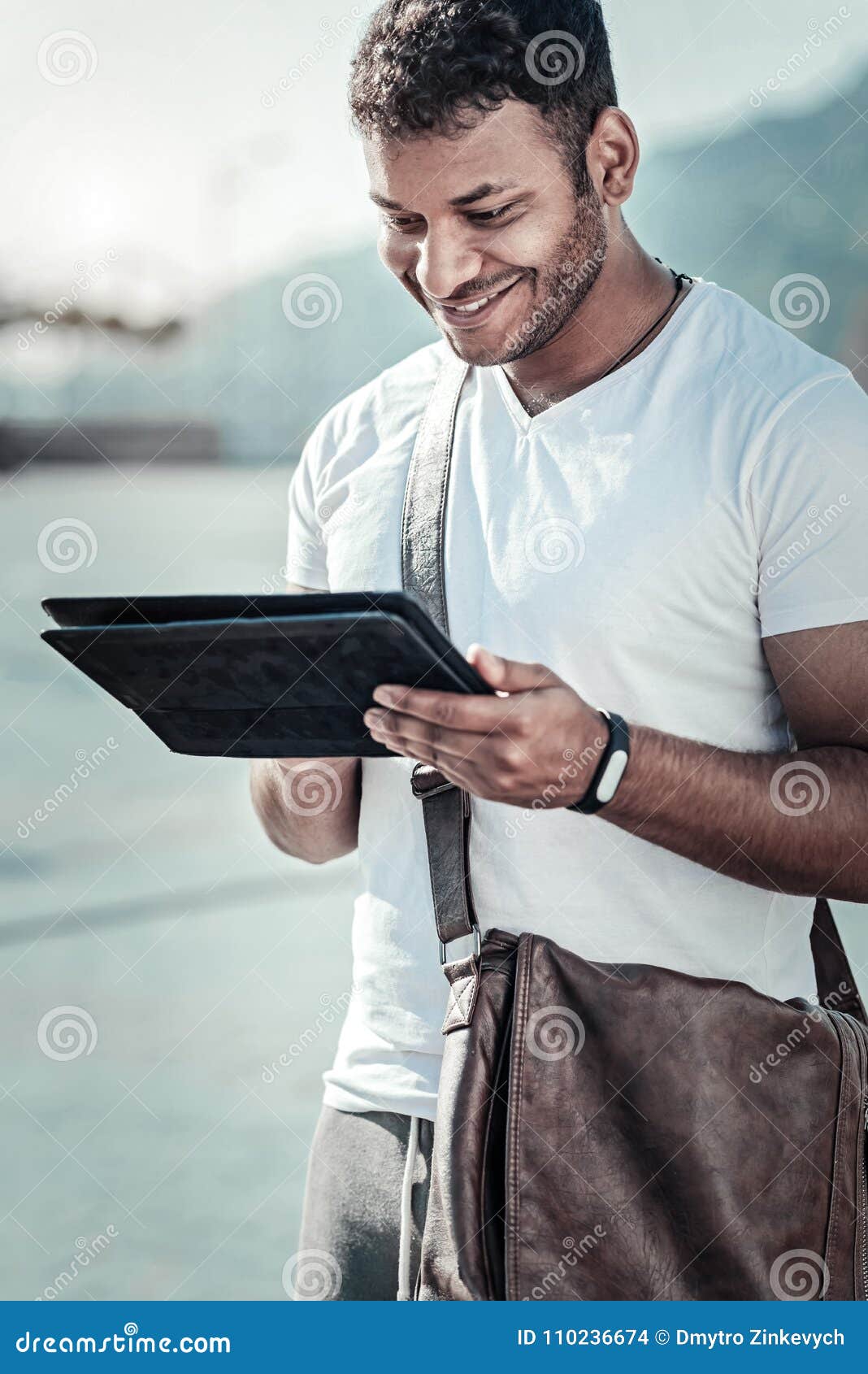 Happy Positive Man Using a Tablet Stock Photo - Image of student ...