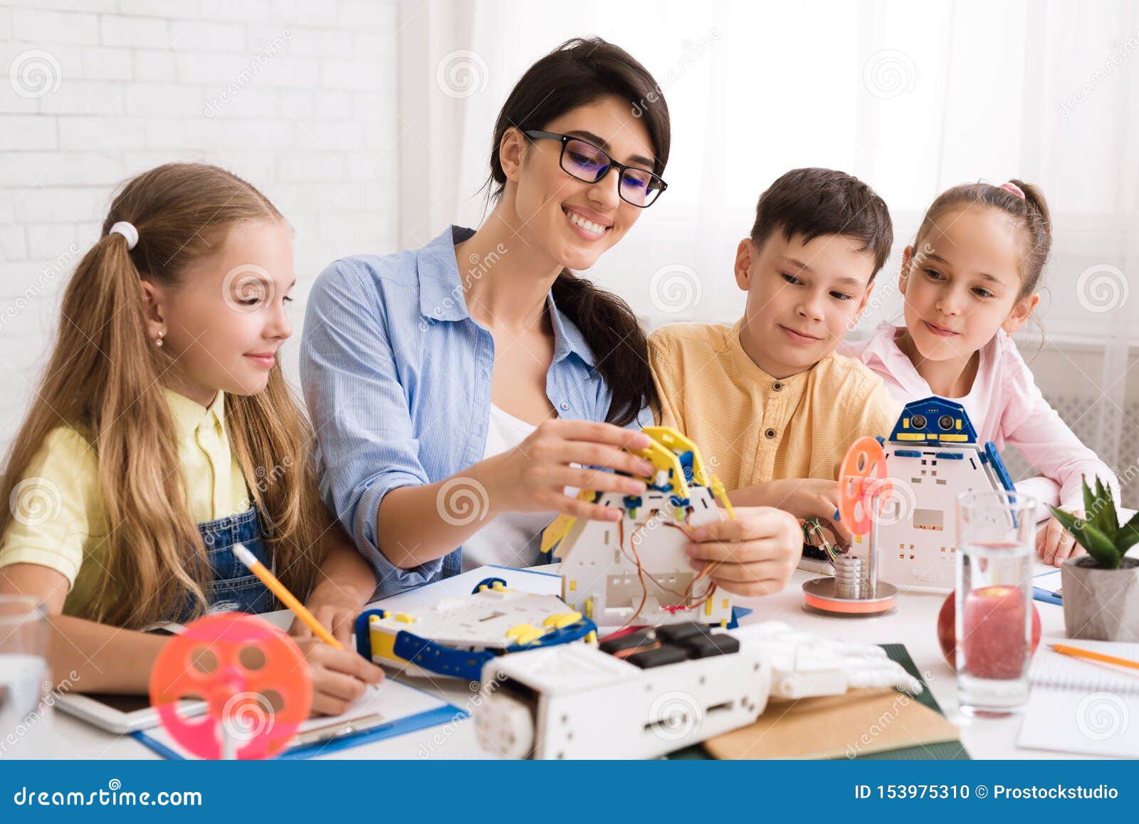 Kids Creating Robots with Teacher at Stem Education Class Stock Photo ...