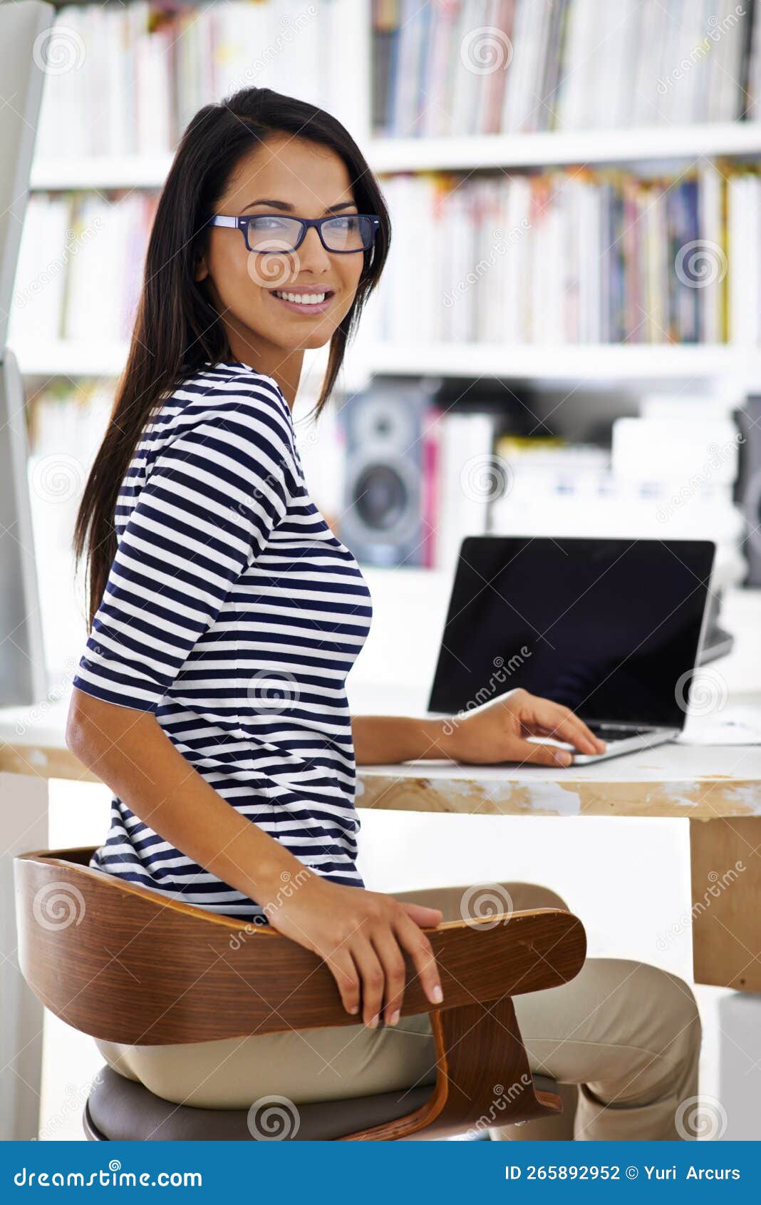 Modern Technology for a Techno-savvy Woman. an Attractive Young Woman Surfing the Net from Her ...