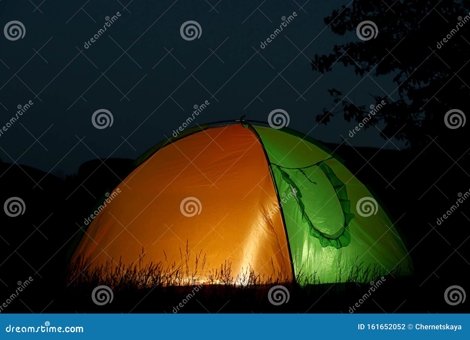 Modern Tent Lit from Inside in Wilderness. Overnight Camping Stock ...