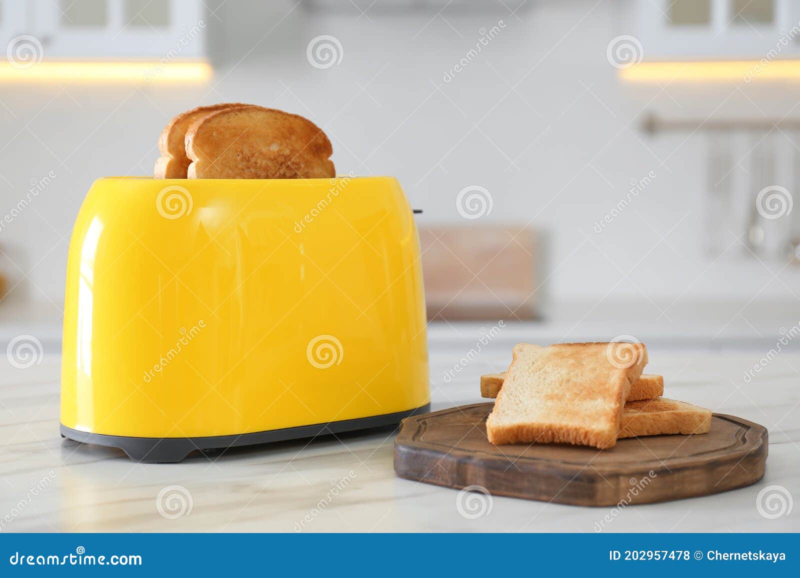 Modern Toaster and Bread Slices on White Marble Table in Kitchen Stock ...
