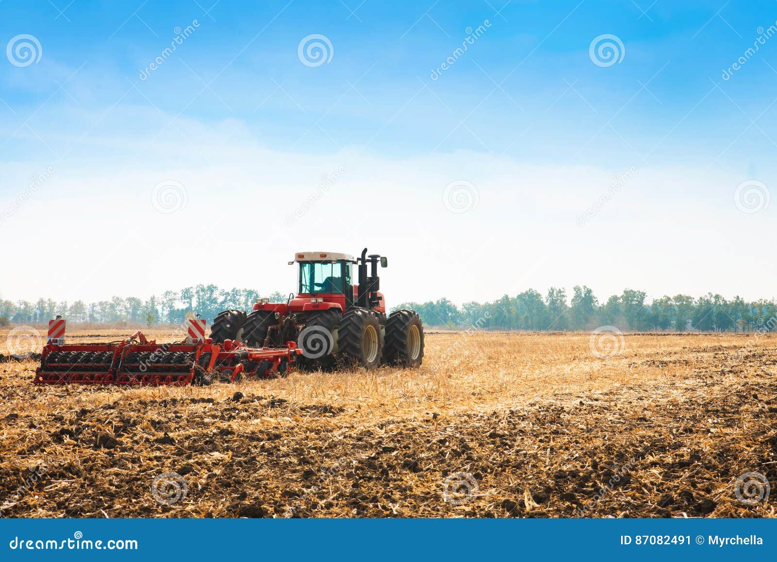 Modern Tractor in the Field with Complex for the Plowing of Soil. Stock ...