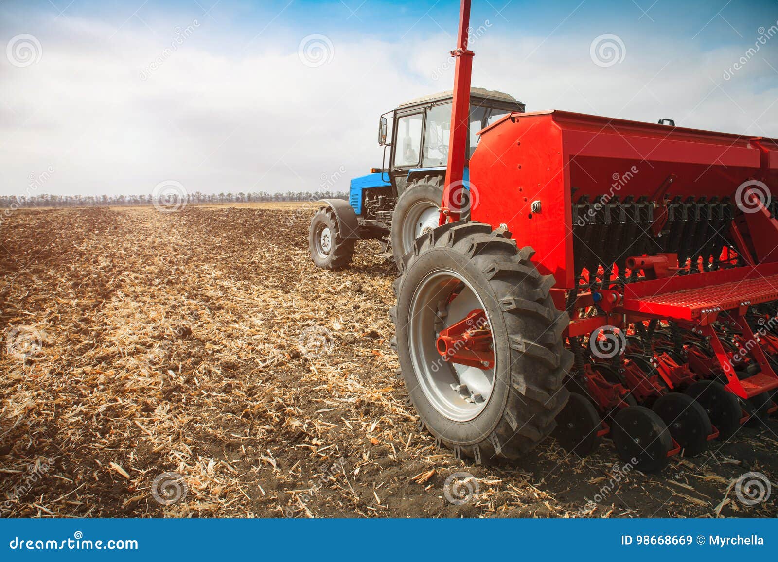Modern Tractor in the Field with Sowing Complex. Stock Image - Image of ...