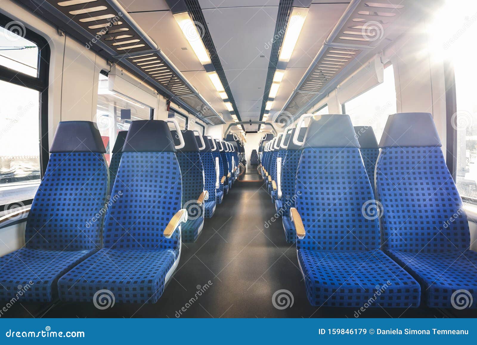 German Train Interior with Two Rows of Empty Seats and Sunlight Stock ...