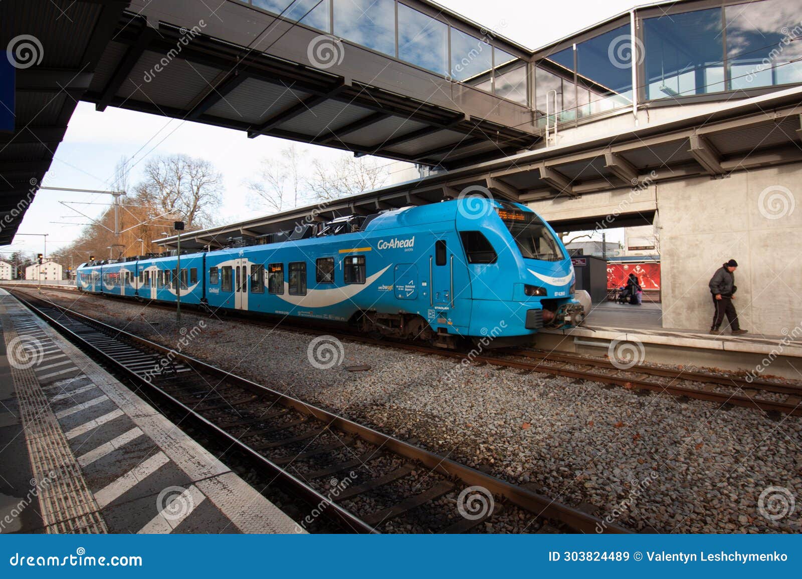 A Train Is Seen Traversing Through A Snowy Forest Illuminated By The ...