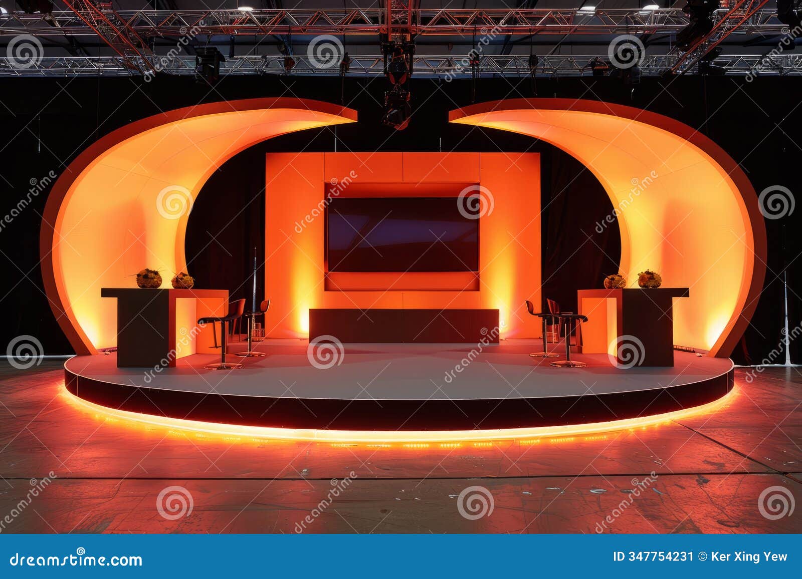 Modern TV Studio Set with Orange Lighting and Contemporary Design Stock ...