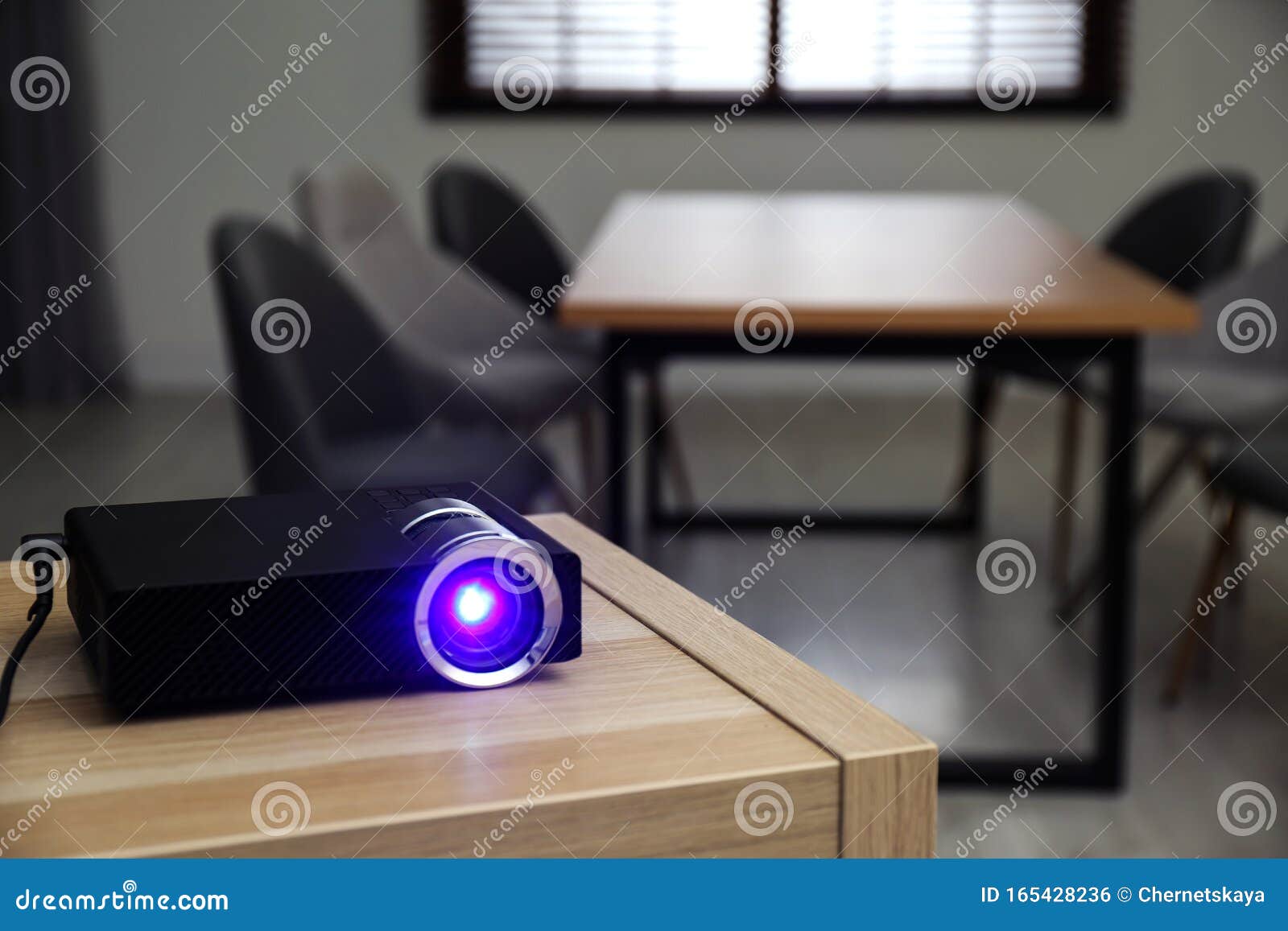 Modern Video Projector on Table in Conference Room. Space for Text ...