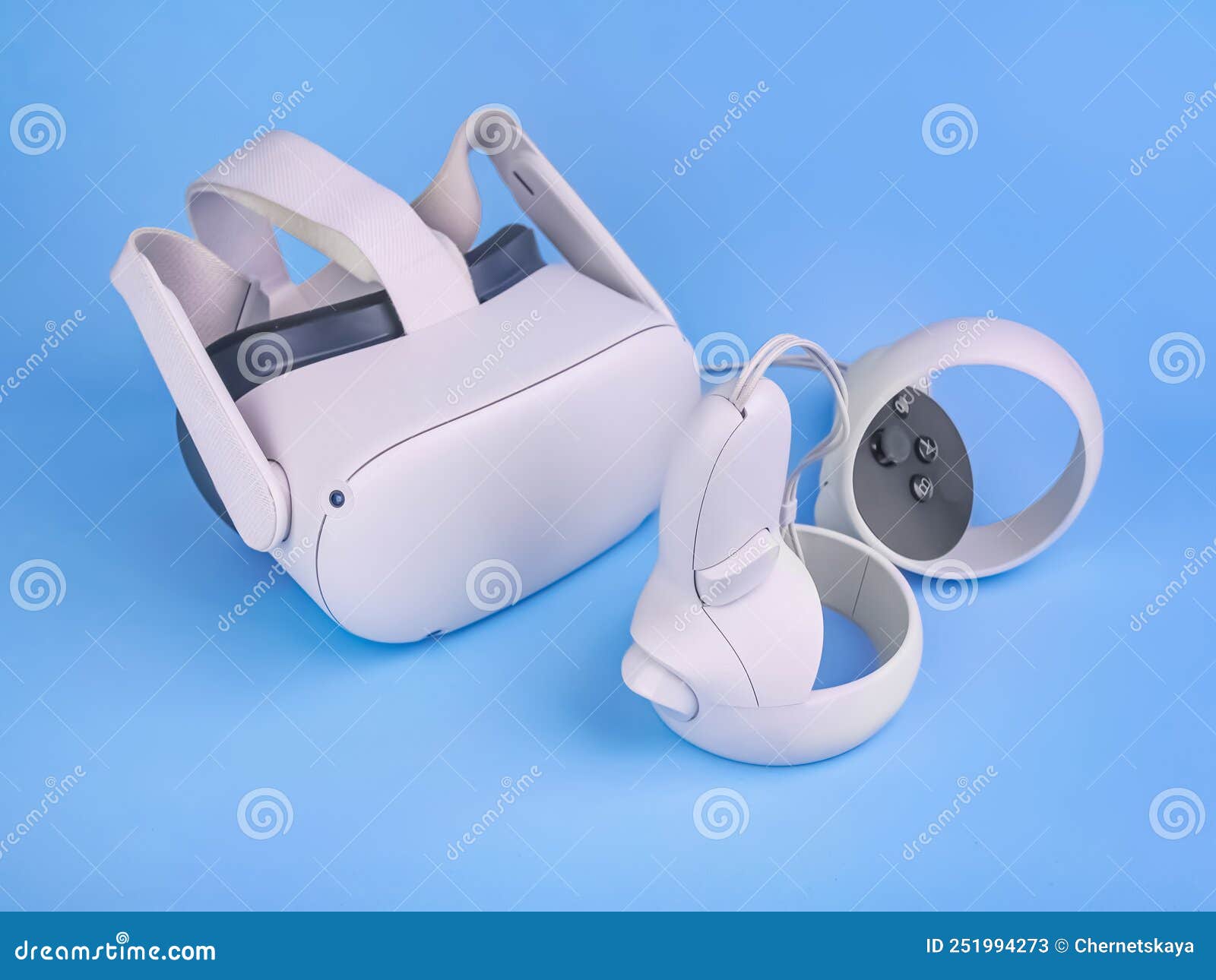 Modern Virtual Reality Headset and Controllers on Light Blue Background ...