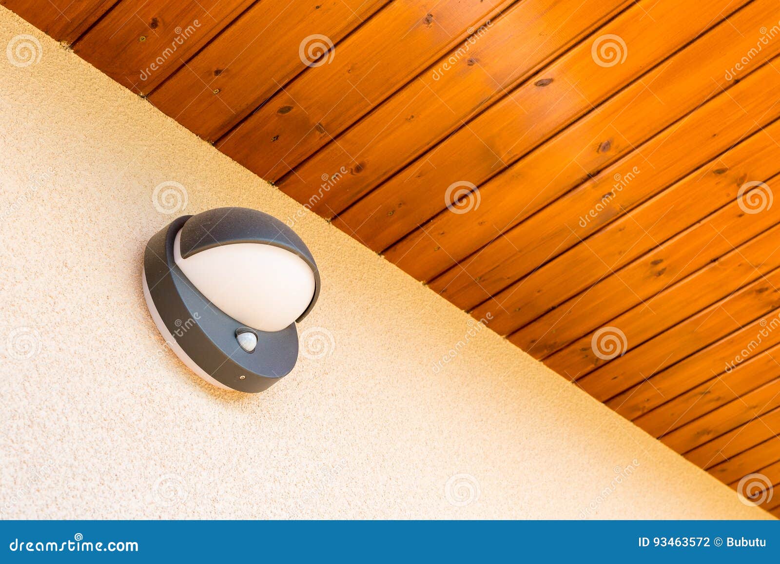 Modern Wall Lamp with Motion and Light Sensor on the Wall Stock Photo ...