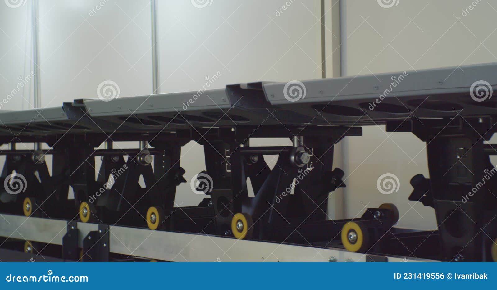 Modern Warehouse Equipment.a Train from Roller Conveyor Carts Moves on ...