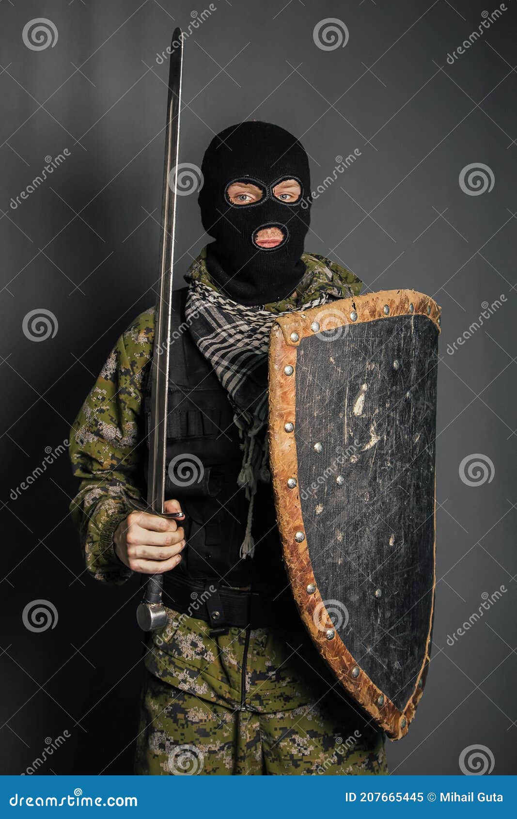 Modern Warrior with Medieval Weapons in His Hands. a Soldier Defends ...