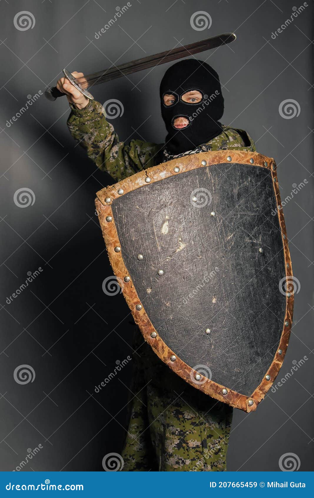 Modern Warrior with Medieval Weapons in His Hands. a Soldier Defends ...