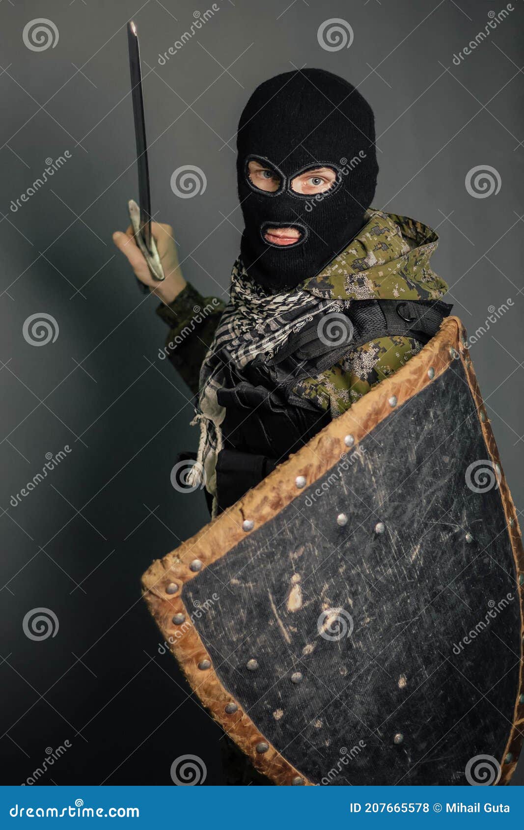 Modern Warrior with Medieval Weapons in His Hands. a Soldier Defends ...