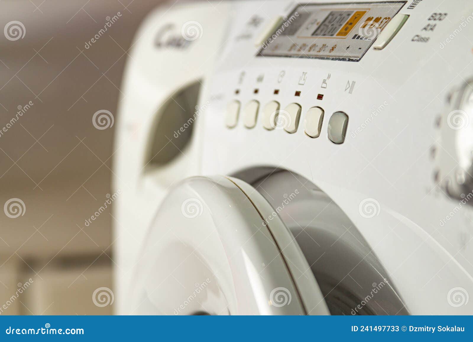 Modern Washing Machine with Laundry. Close-up of Control Buttons and ...