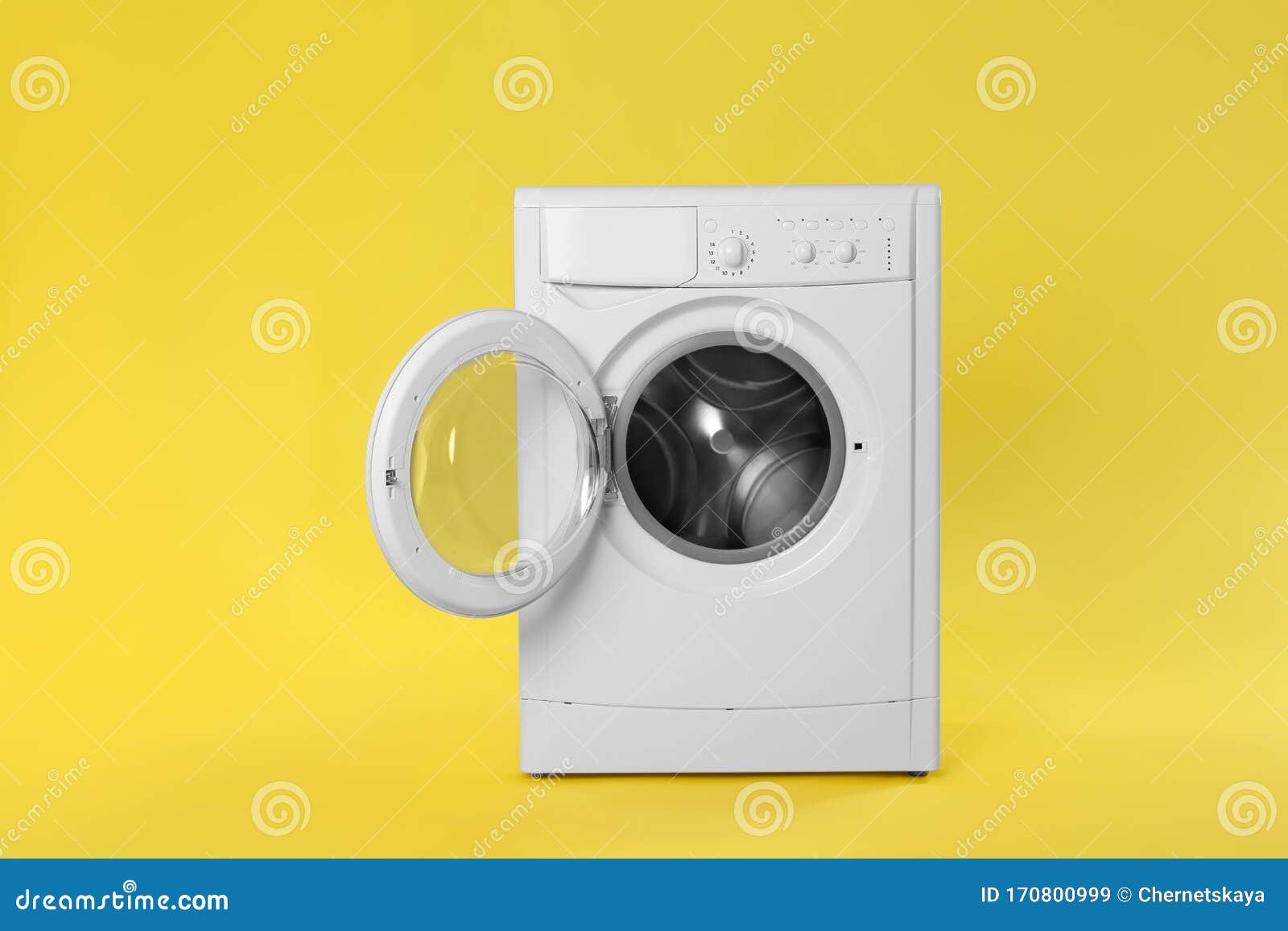 Modern Washing Machine on Yellow Background. Laundry Day Stock Image ...