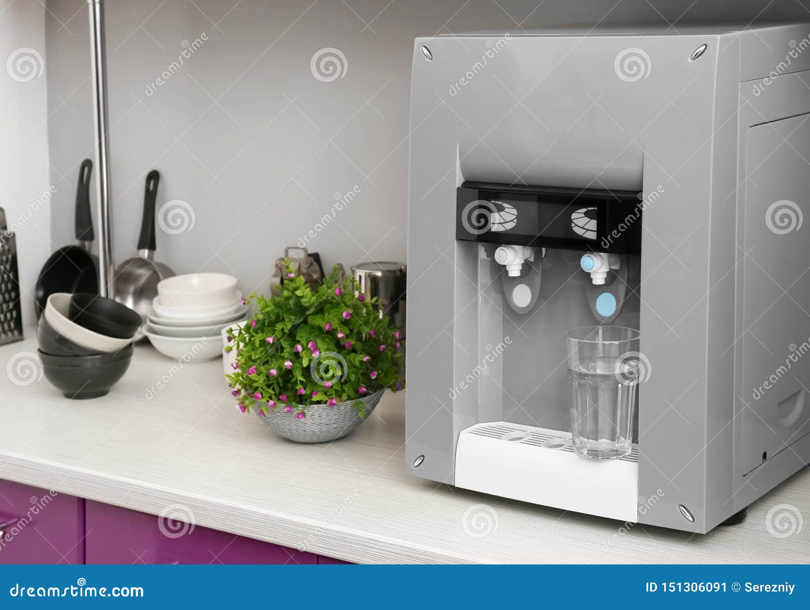 Modern Water Cooler with Glass on Kitchen Table Stock Image - Image of ...