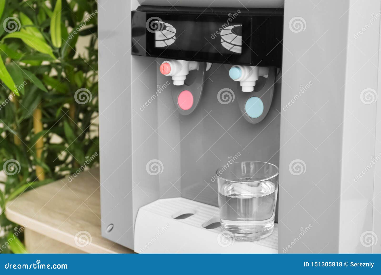 Modern Water Cooler with Glass on Table in Office Stock Photo - Image ...
