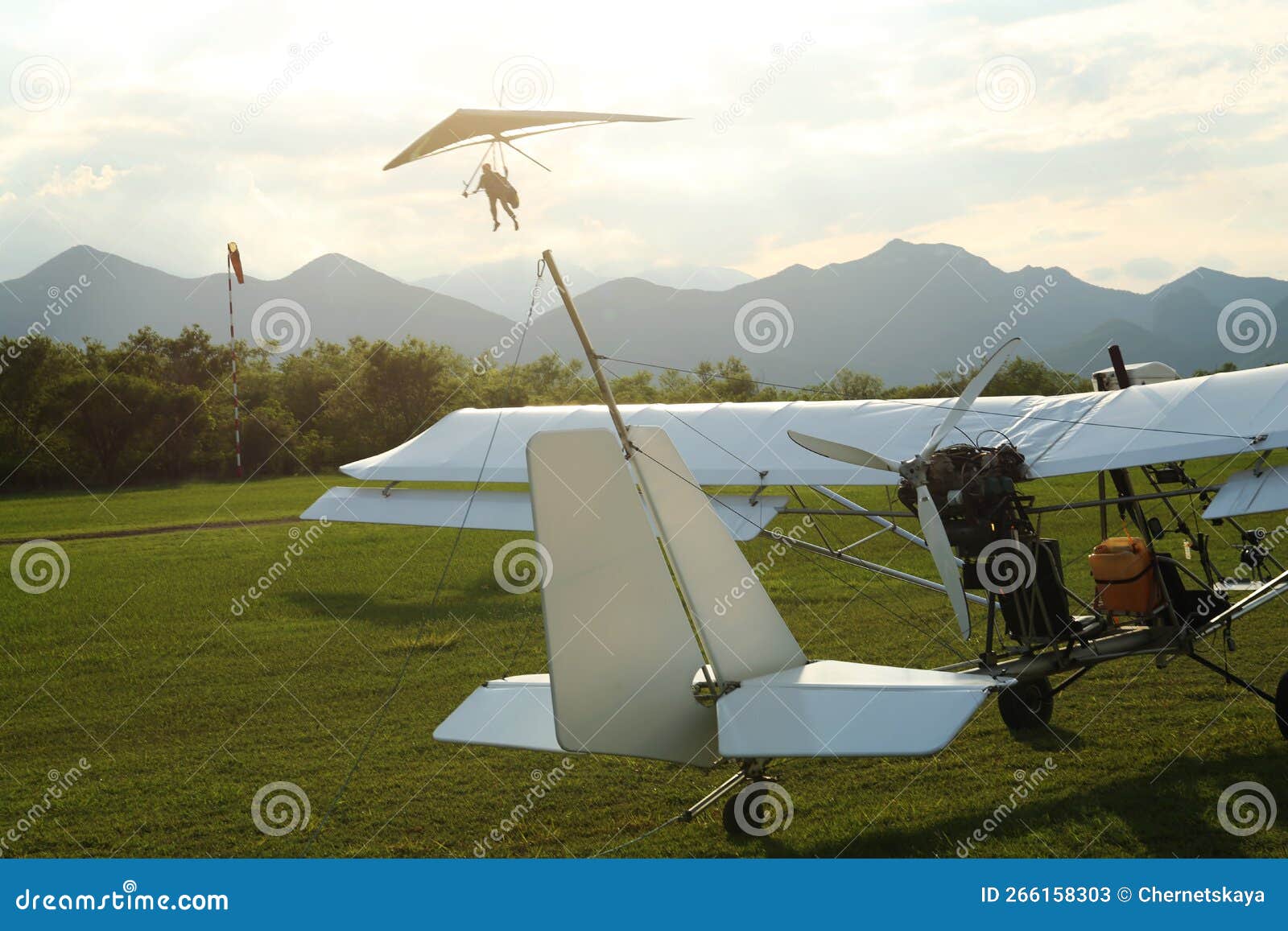 Modern White Airplane on Green Grass Outdoors Stock Image - Image of ...
