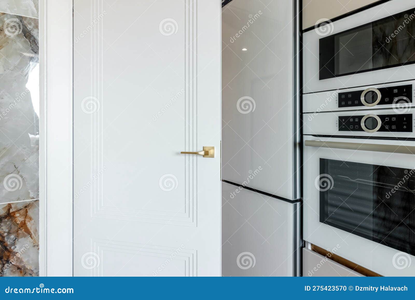 Modern White Door with Gold Handle Open, Fridge and Oven Stock Photo ...