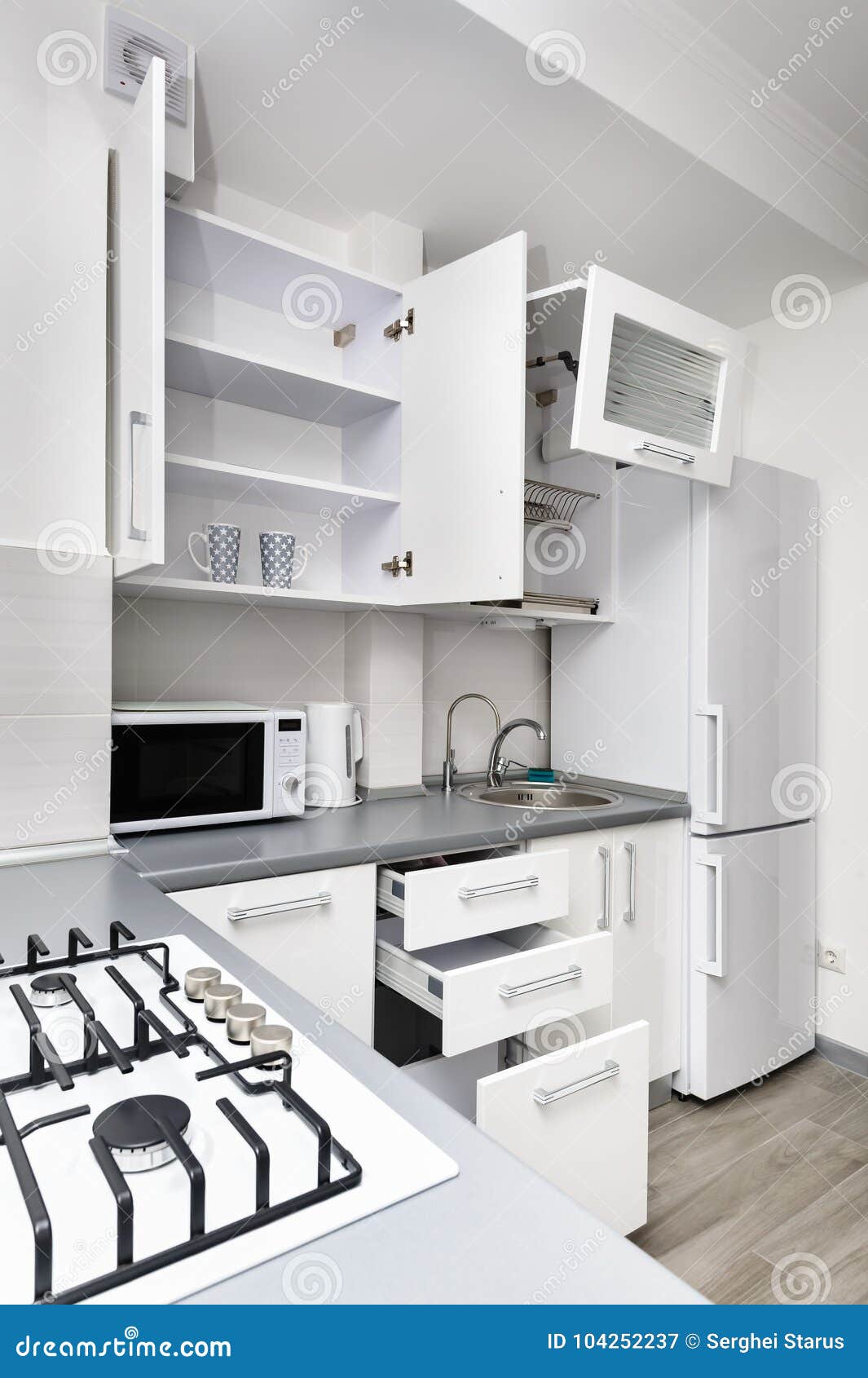 Modern white kitchen stock image. Image of fridge, oven - 104252237