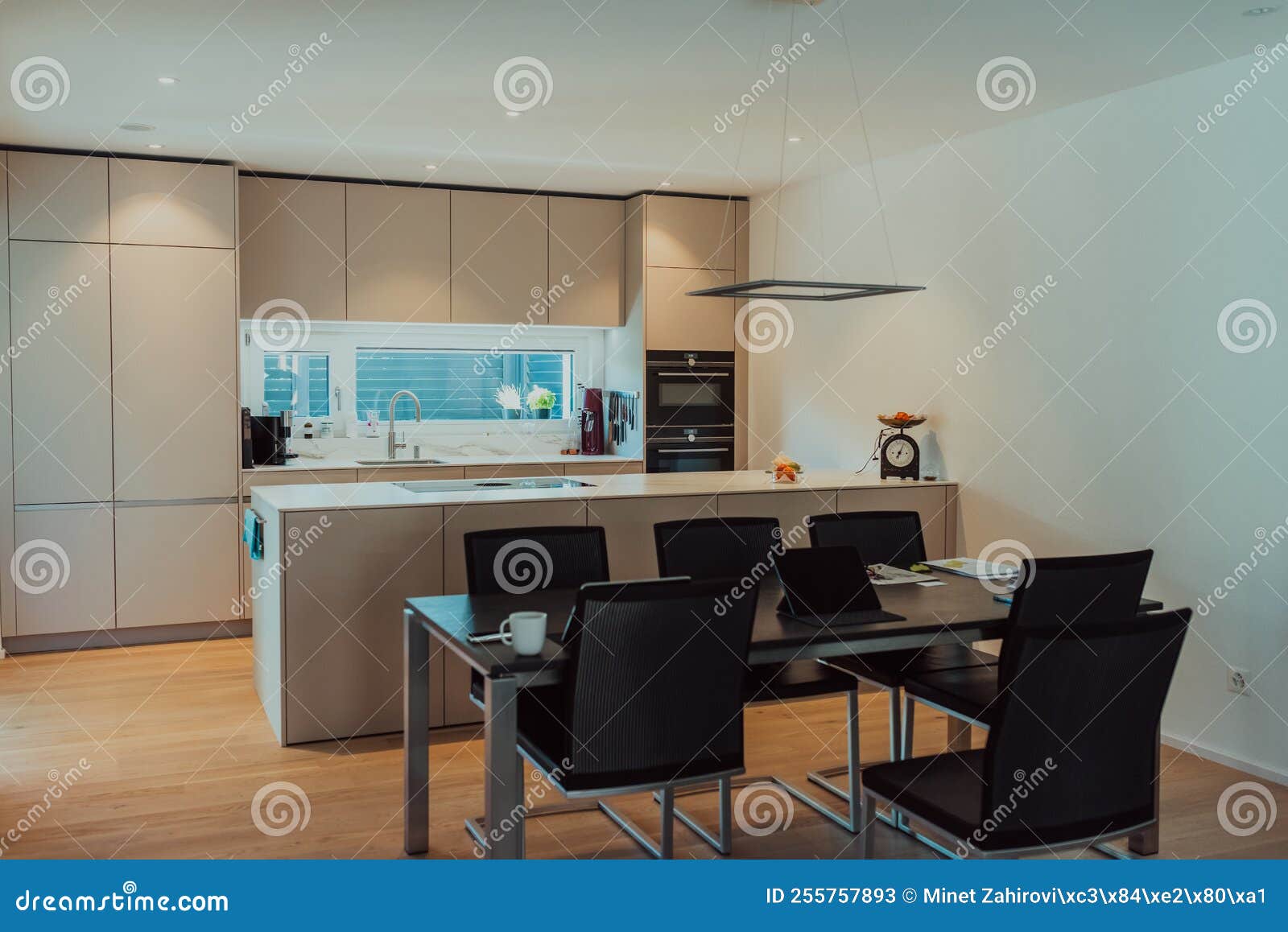 Modern White Kitchen with Electronic Devices and Decorative Items Stock ...