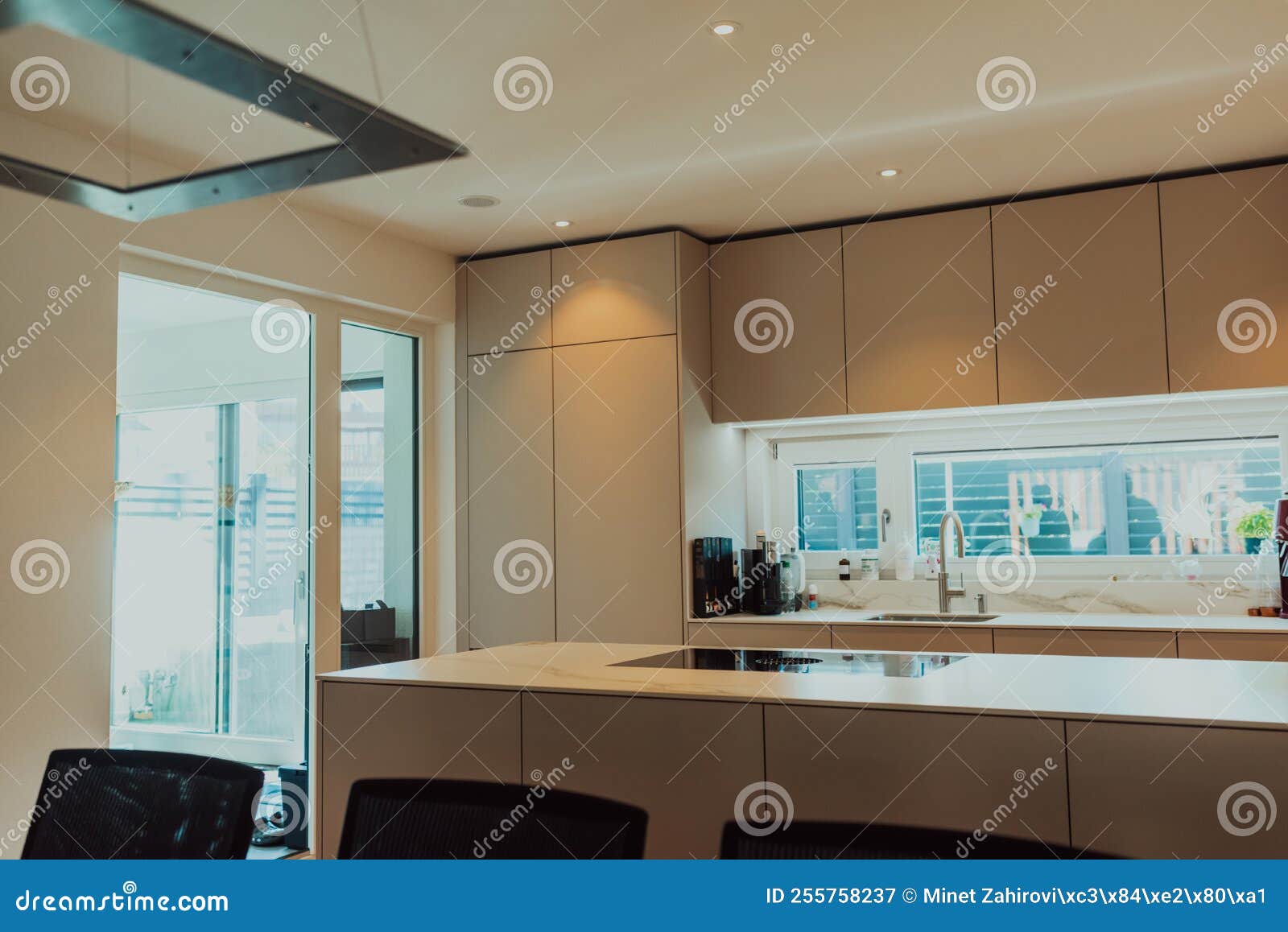 Modern White Kitchen with Electronic Devices and Decorative Items Stock ...