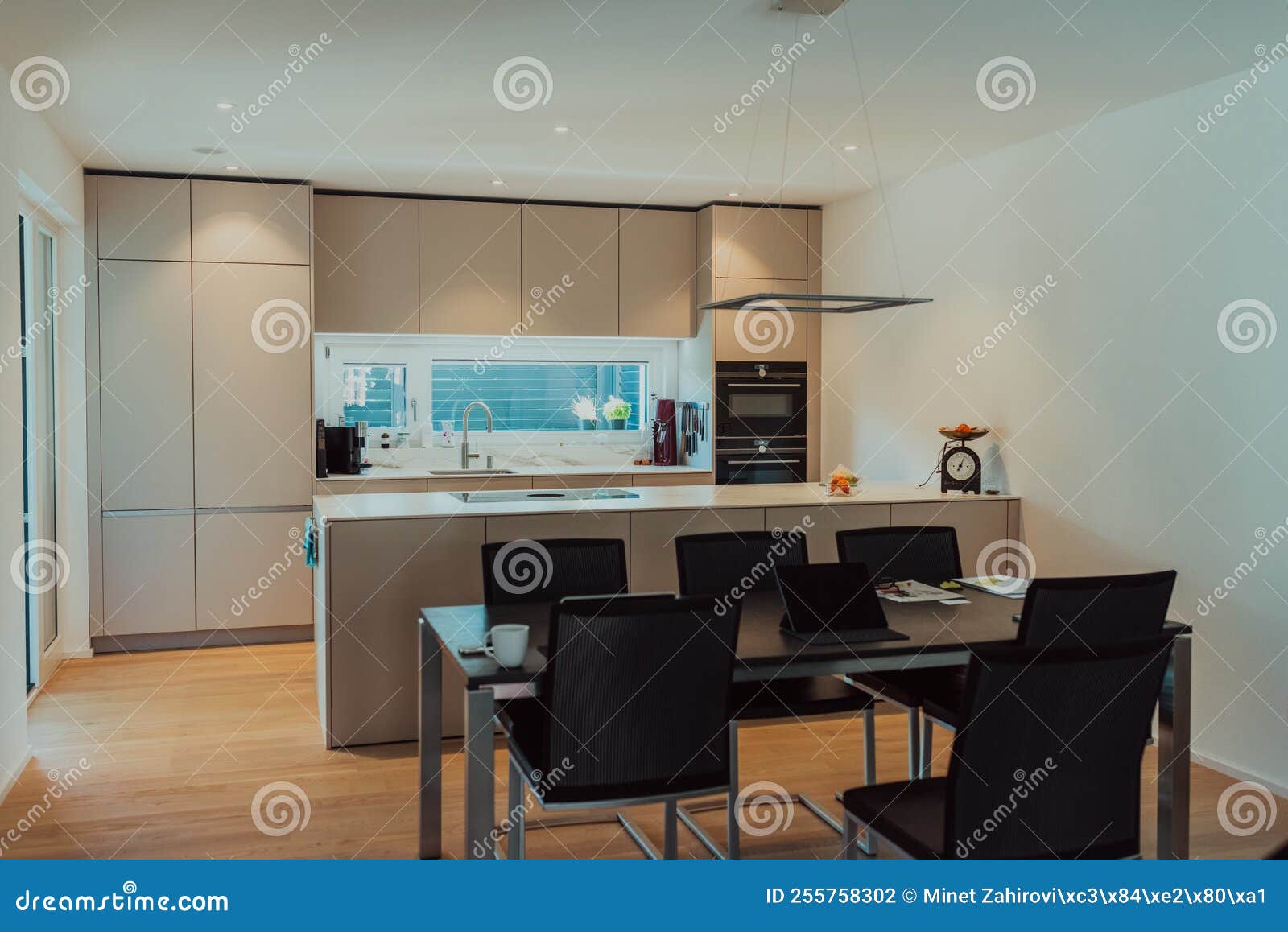 Modern White Kitchen with Electronic Devices and Decorative Items Stock ...