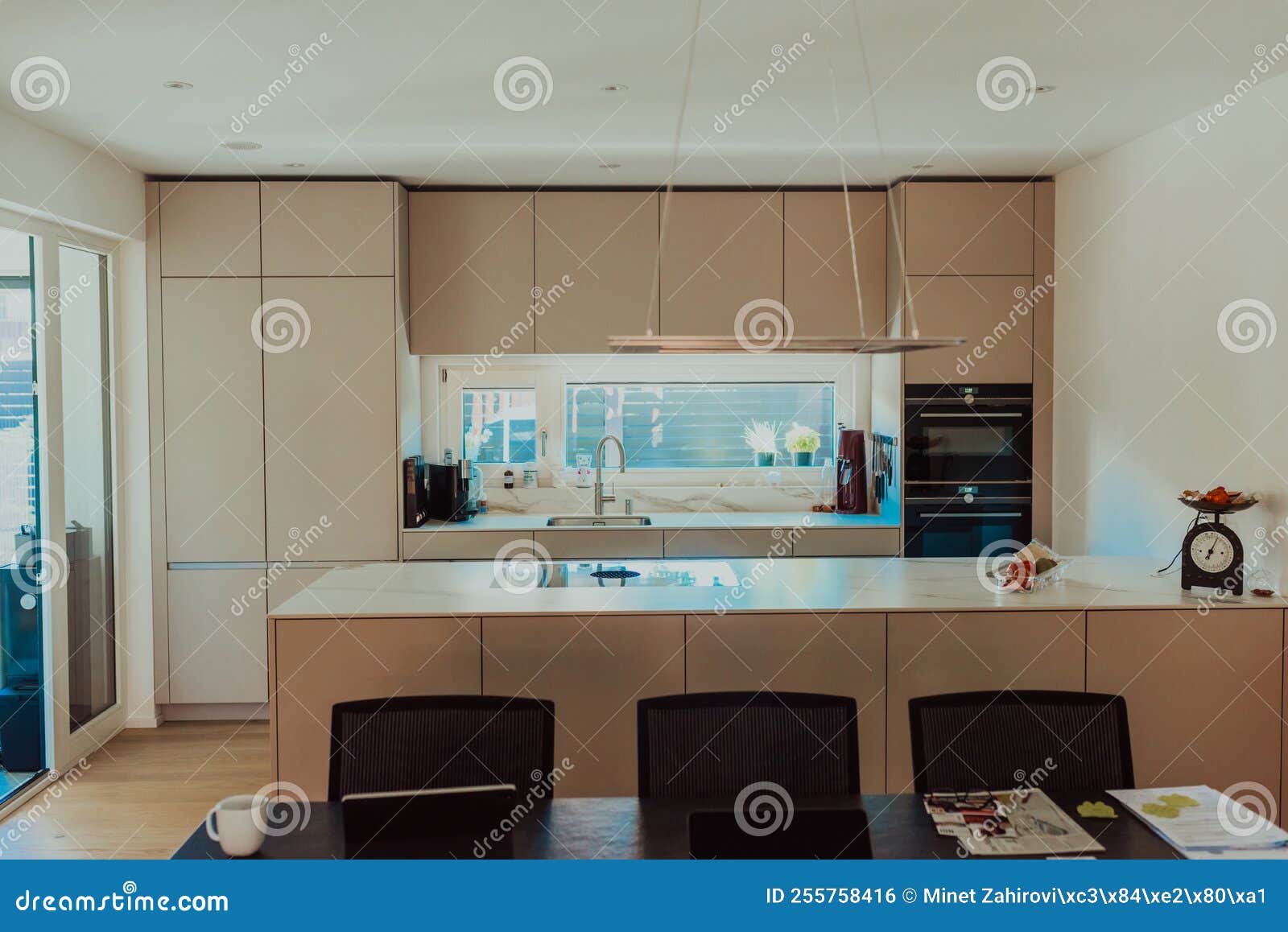 Modern White Kitchen with Electronic Devices and Decorative Items Stock ...