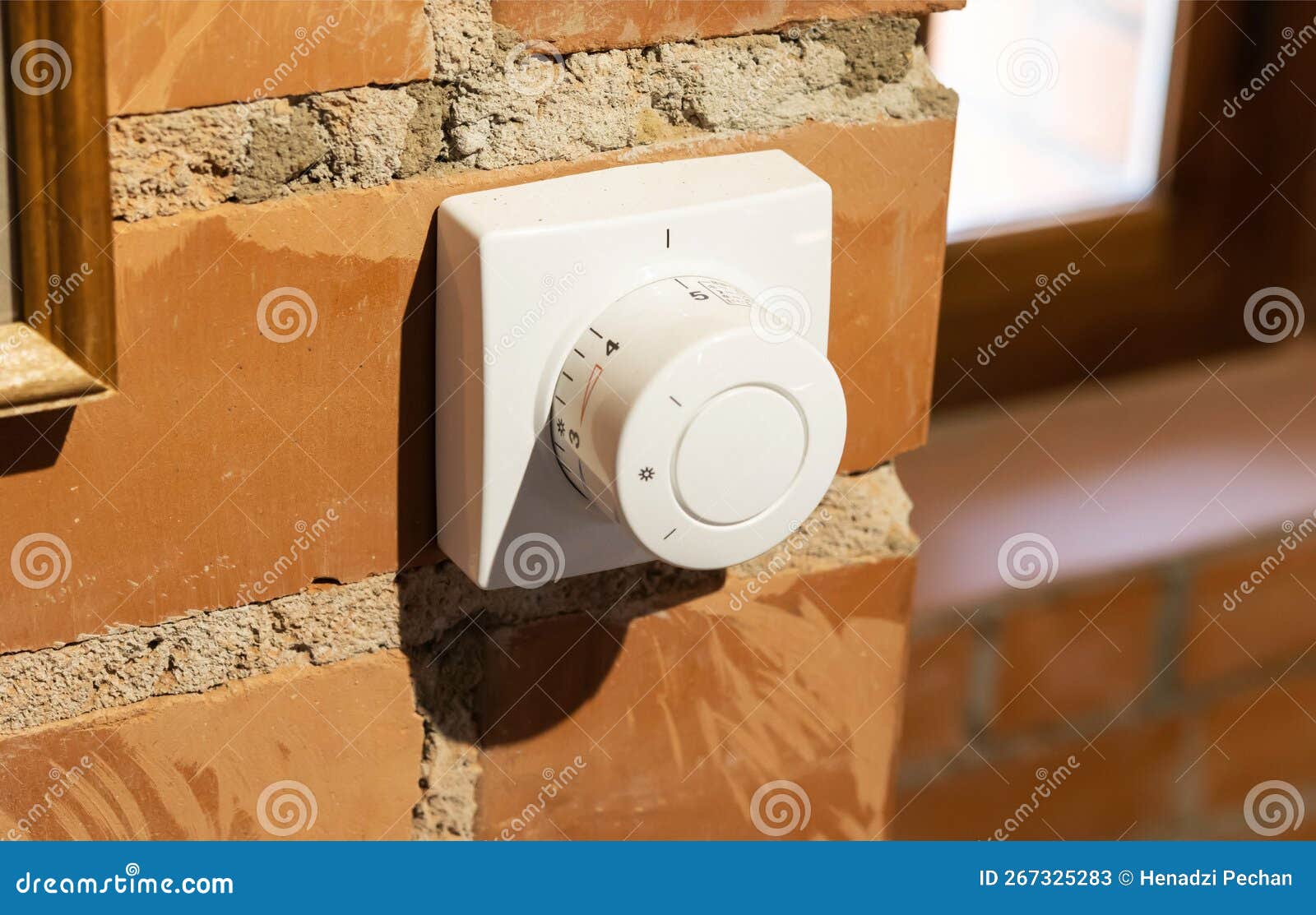 Modern White Room and Floor Heating Controller on a Brick Wall, Close ...