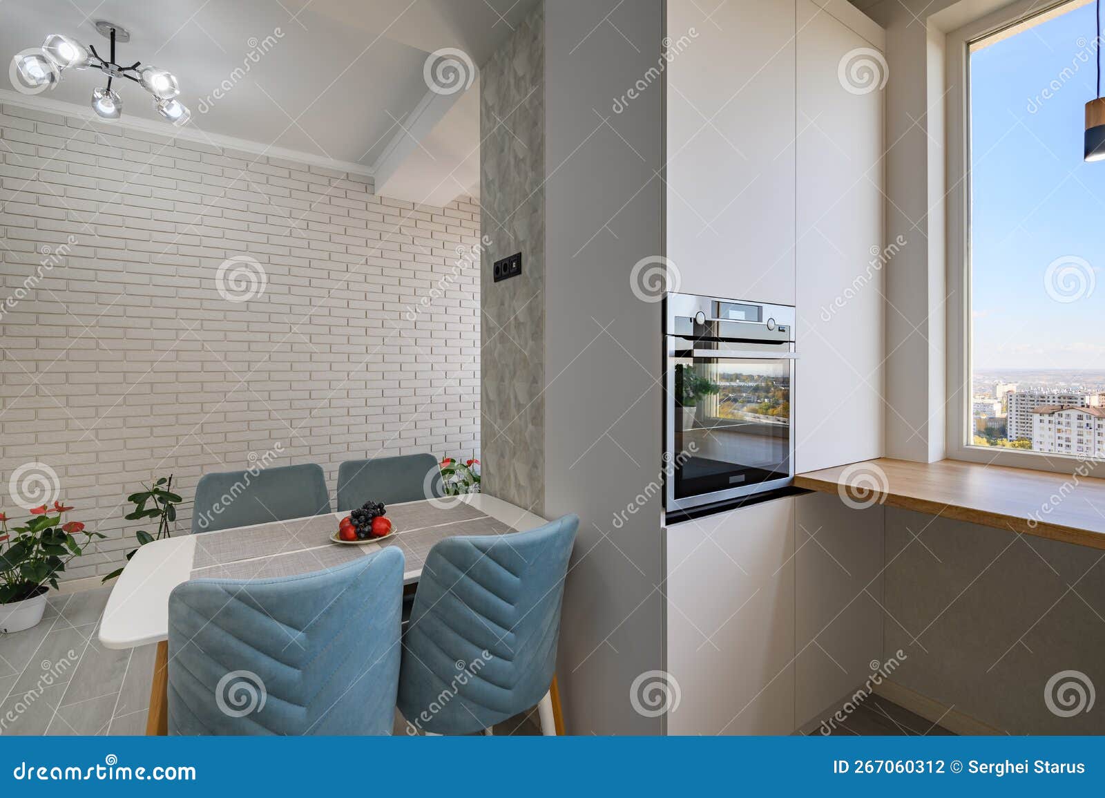 A Modern White Studio Apartment with a Dining Table Stock Photo - Image of bright, decor: 267060312