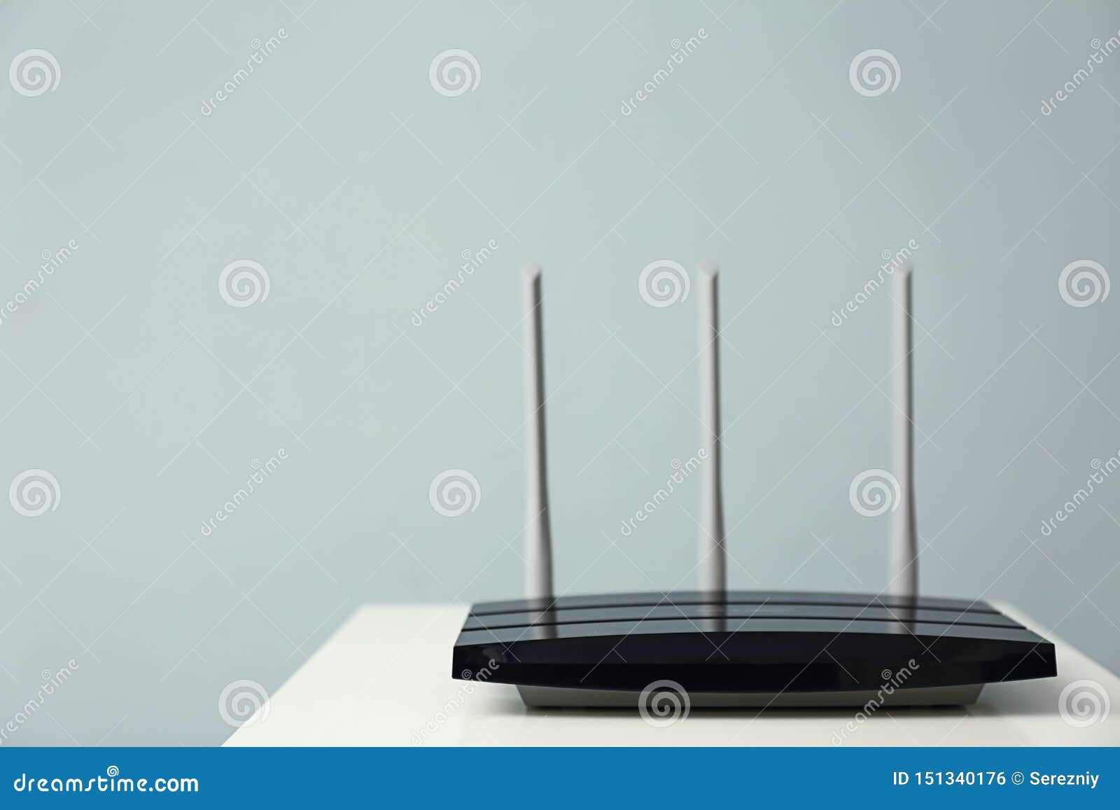 Modern Wi-fi Router on Light Table Against Light Background Stock Photo ...