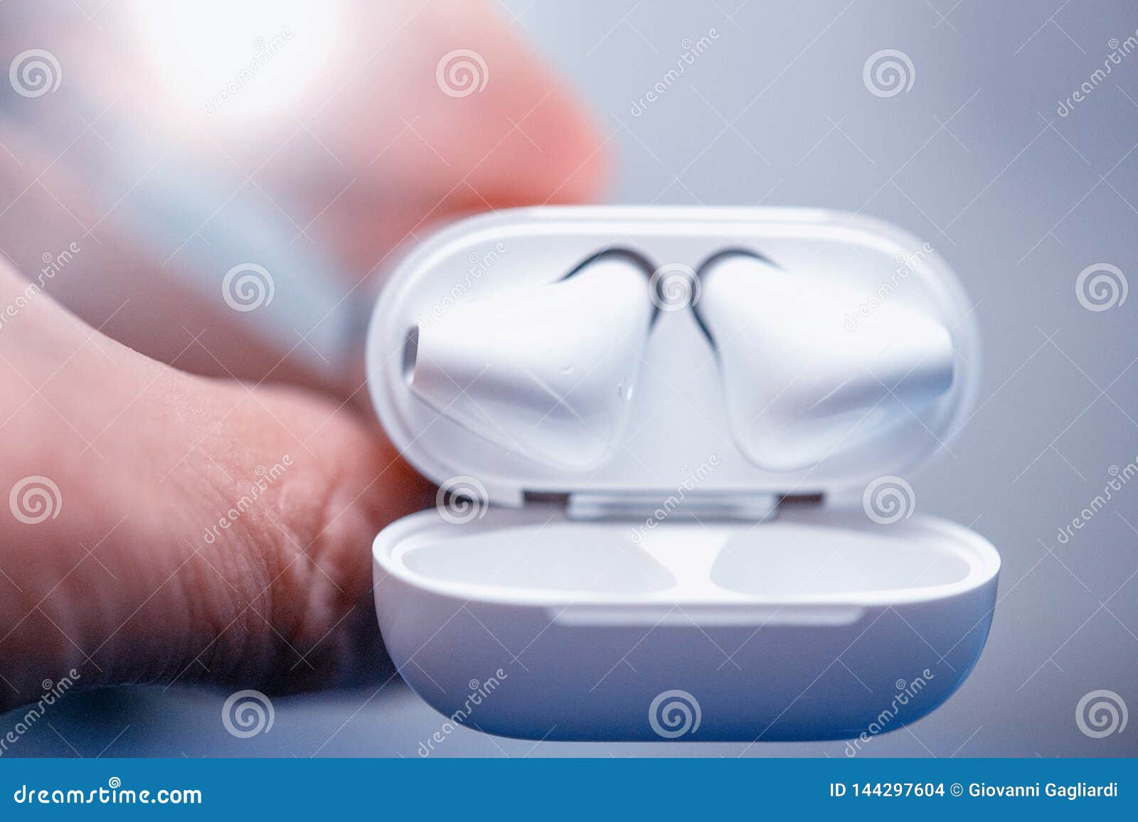 Modern Wireless Earphones Held by Man S Hand Stock Photo - Image of ...