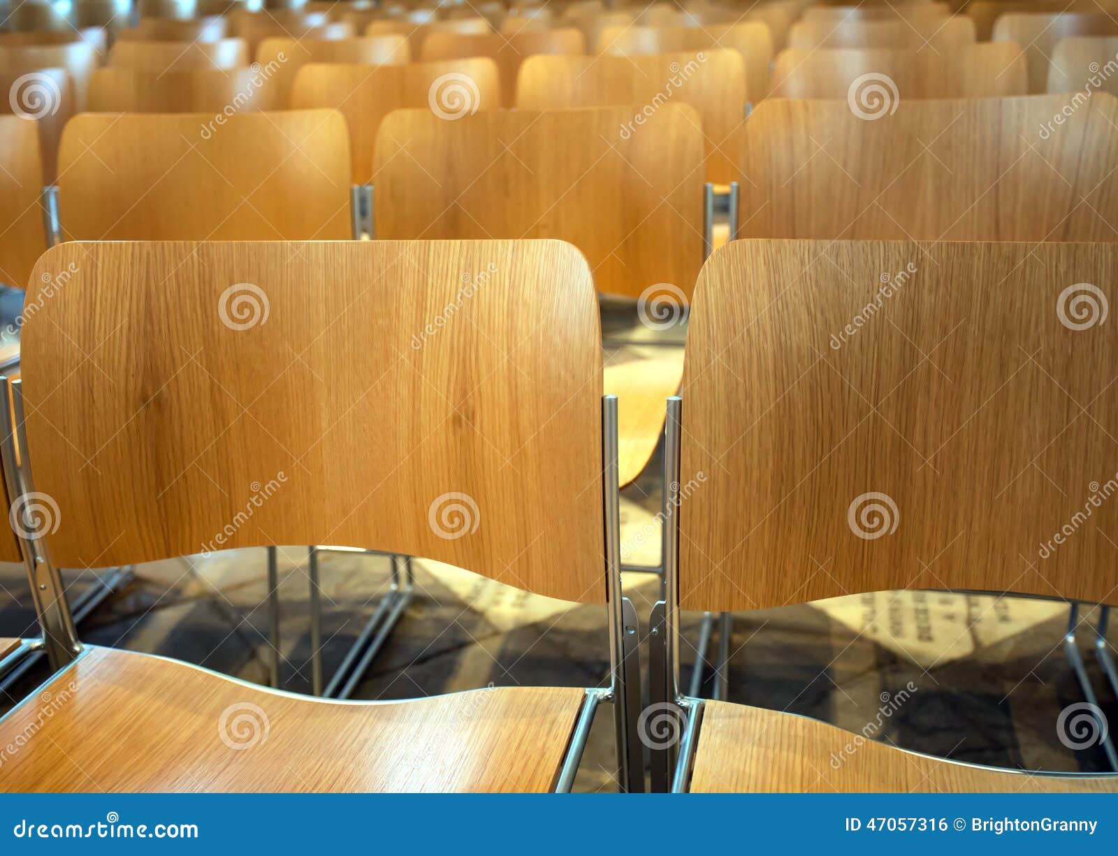 Modern wooden chairs stock photo. Image of interior, rows - 47057316