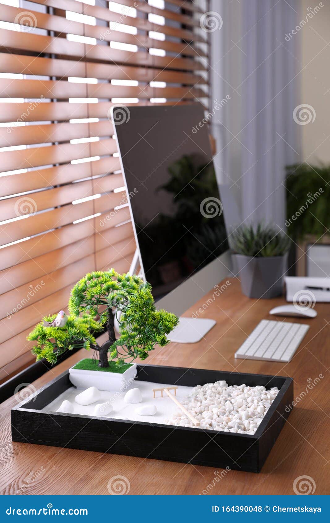 Modern Workplace with Beautiful Miniature Zen Garden and Computer Stock ...
