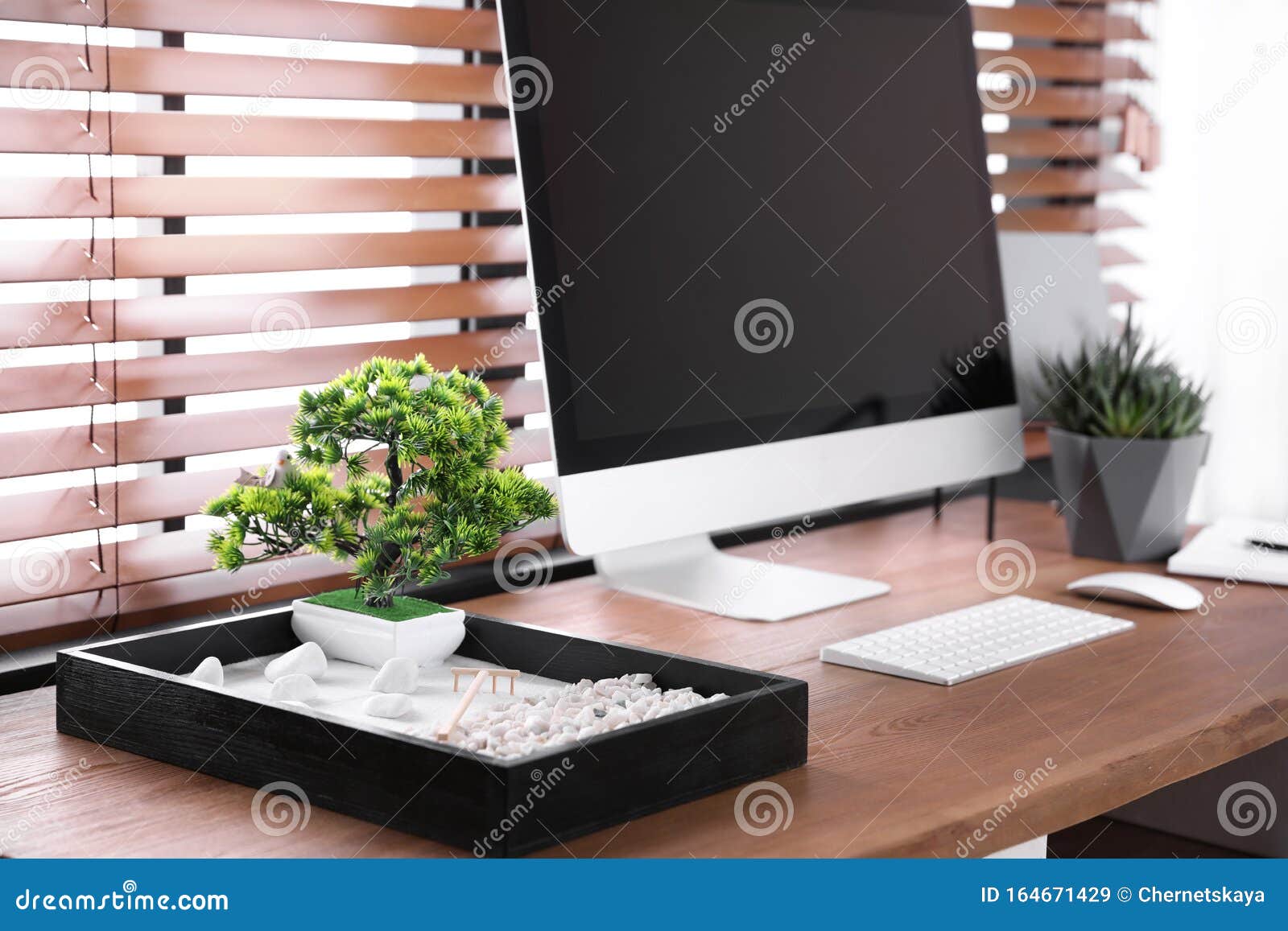 Modern Workplace with Beautiful Miniature Zen Garden and Computer Stock ...