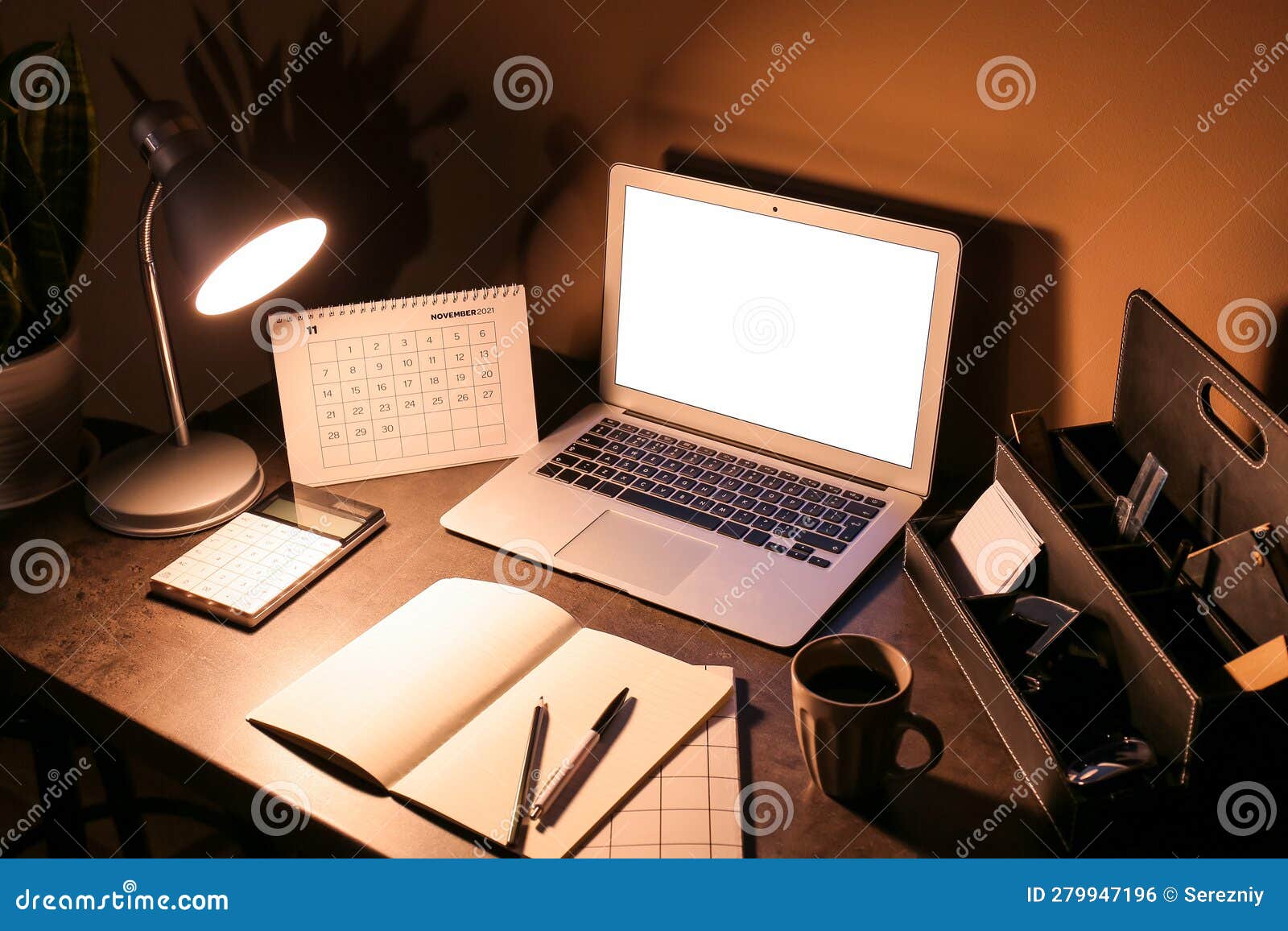 Modern Workplace with Computer and Glowing Lamp Near Color Wall Stock ...