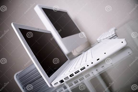 Modern Workplace with White Laptop & Computer. Til Stock Photo - Image ...