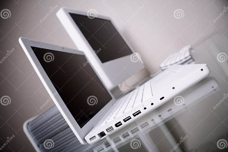 Modern Workplace with White Laptop & Computer. Til Stock Photo - Image ...