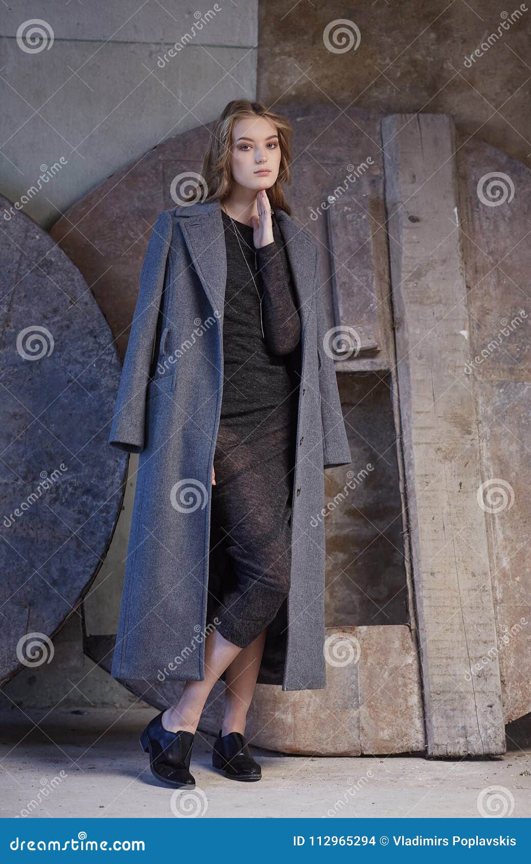 A Lady in a Long Grey Jacket. Stock Photo - Image of grey, color: 112965294