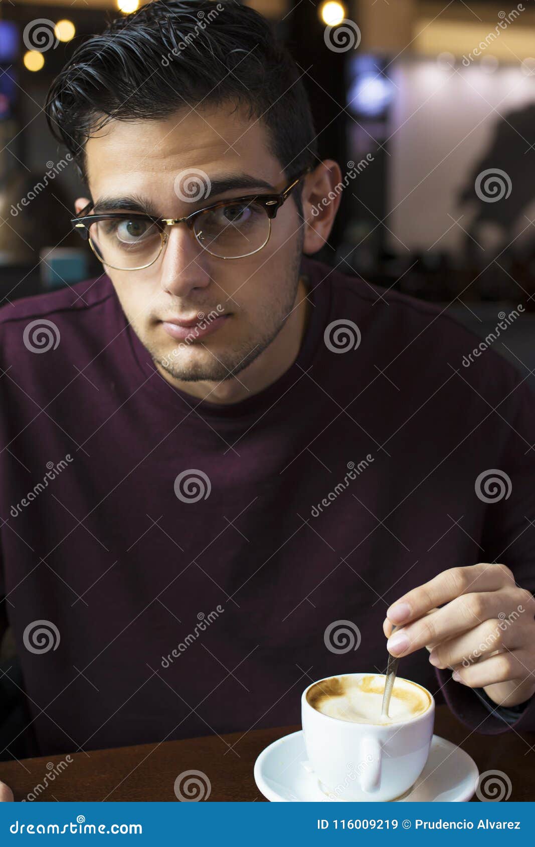 Young man drinking coffee stock image. Image of glasses - 116009219 Young man drinking coffee stock image. Image of glasses - 116009219