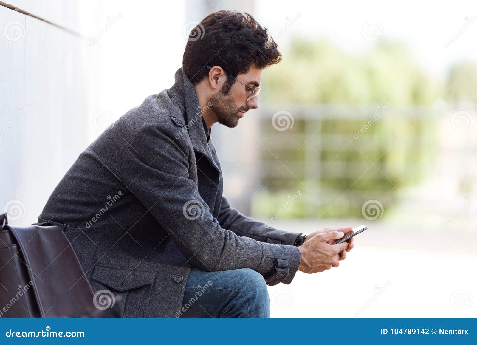 Modern Young Man Using His Mobile Phone in the Street. Stock Photo ...