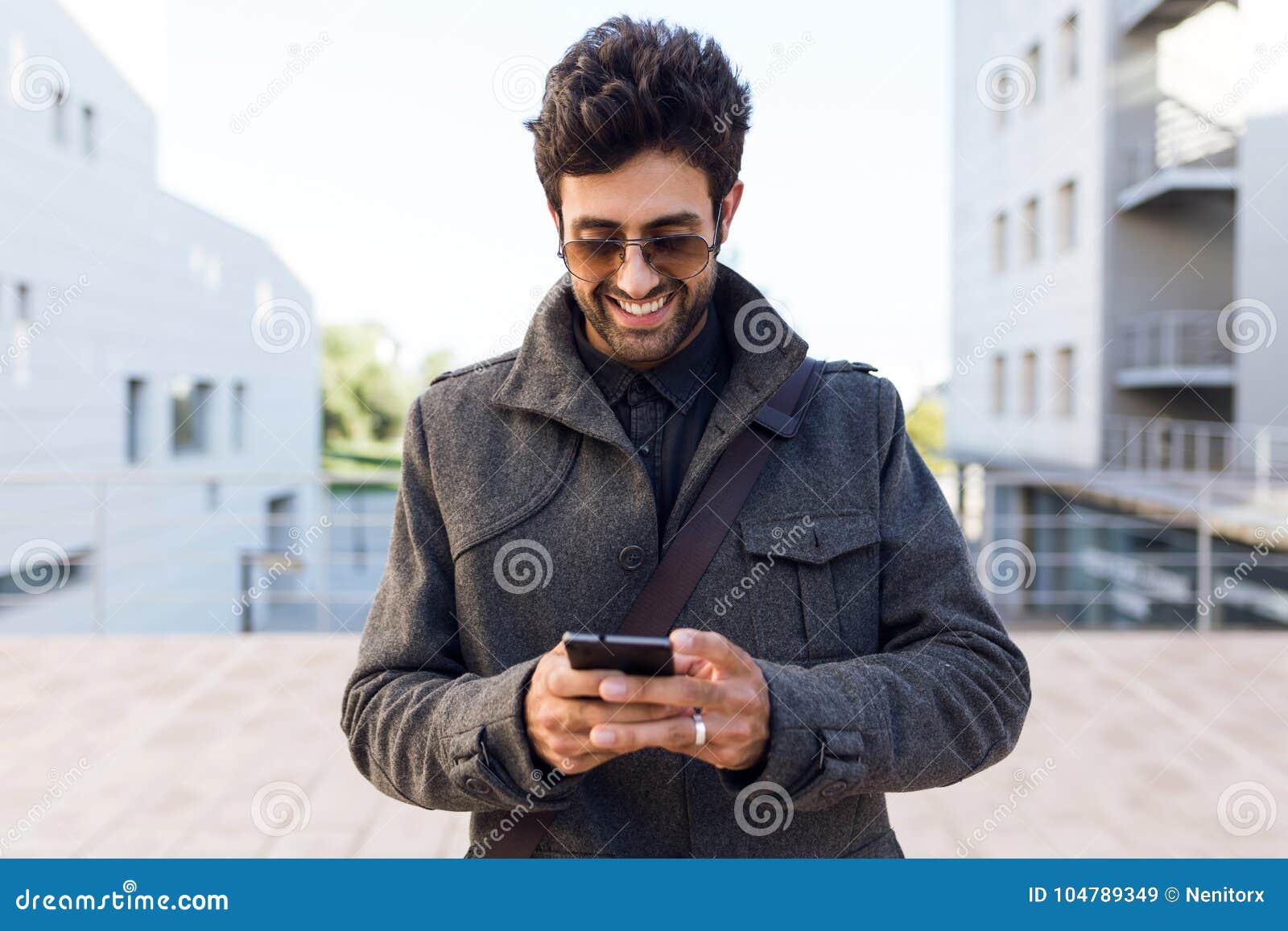 Modern Young Man Using His Mobile Phone in the Street. Stock Image ...