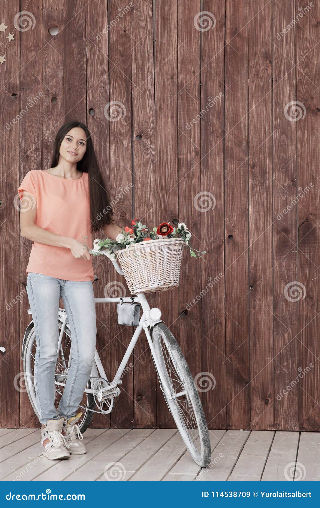 Modern Young Woman with Bicycle and Spring Flowers in Basket Stock ...