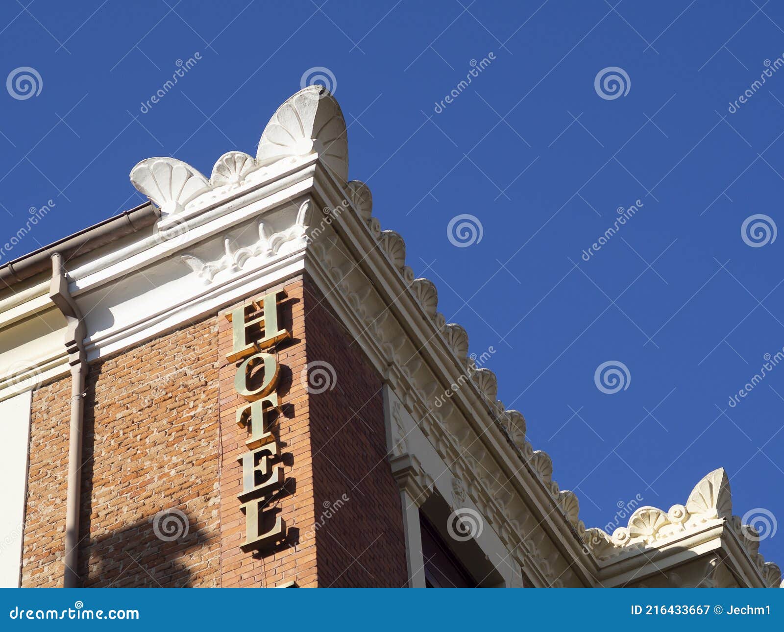 Modernist Hotel Lettering with Red Brick Wall Stock Image - Image of ...