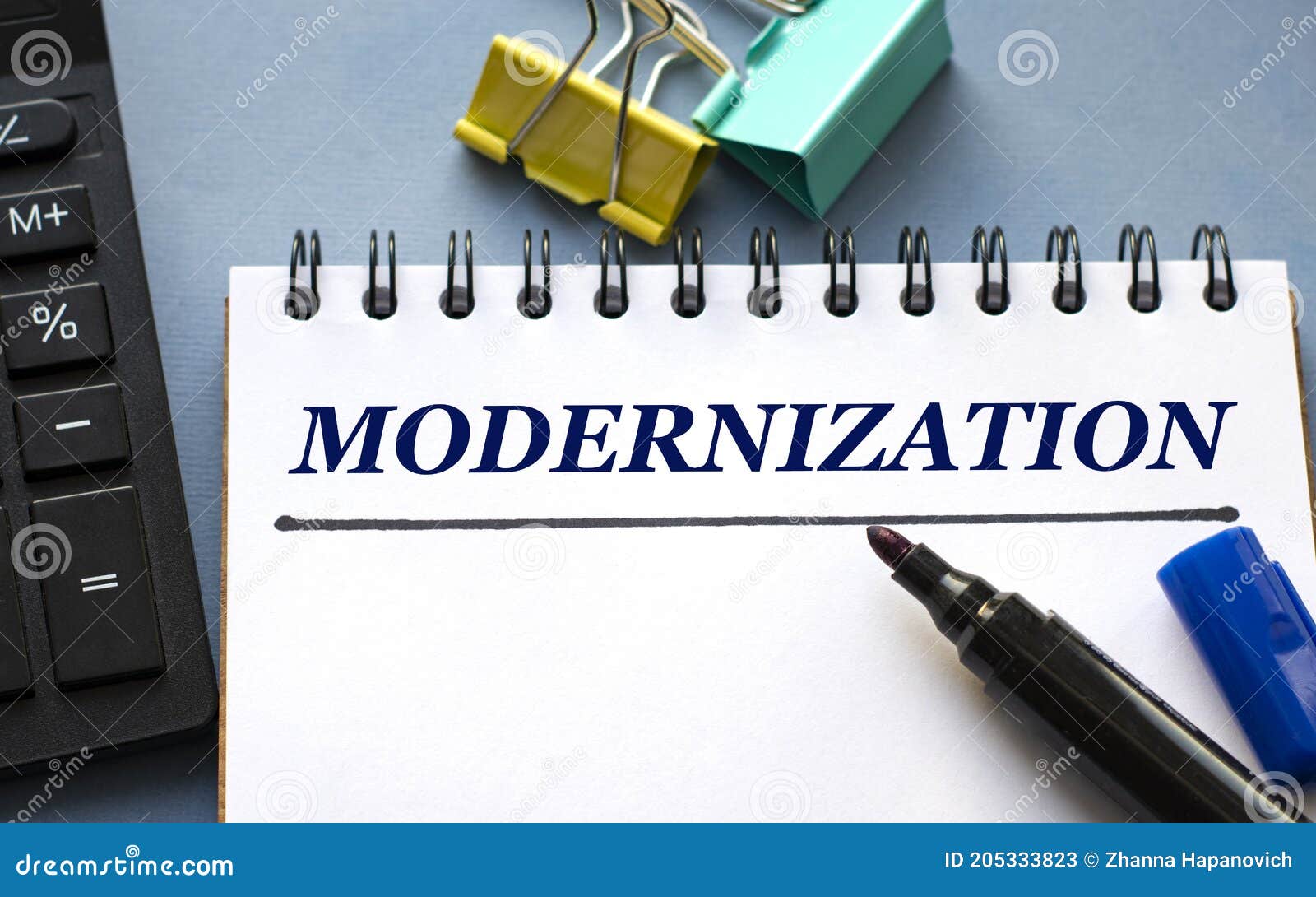 MODERNIZATION Word is Written in a Notebook with a Marker, Calculator ...