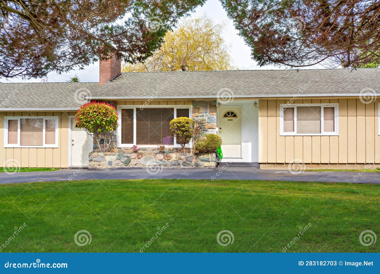 Modest Residential Duplex House in Canada with Green Lawn in Front ...