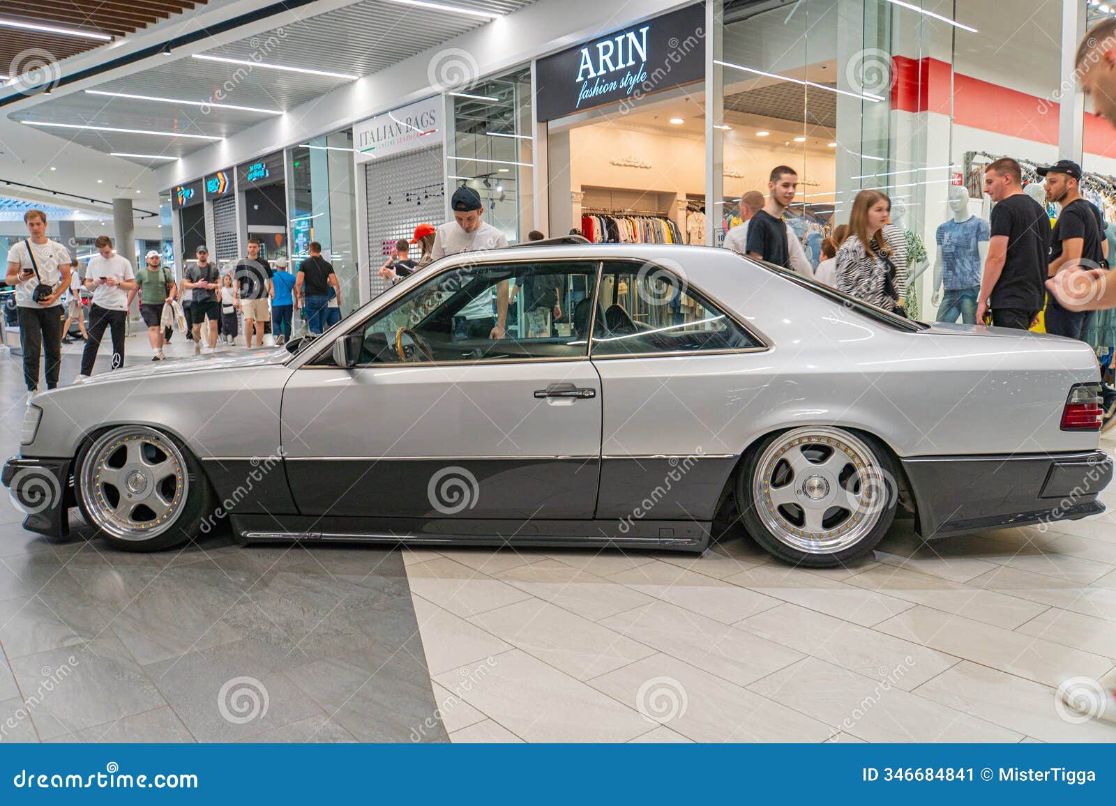 A Modified Dark-colored Car with a Body Kit, Wide Arches, and Custom ...