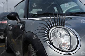 Modified Headlights of a Mini with Fake Eyelashes Stock Photo - Image ...